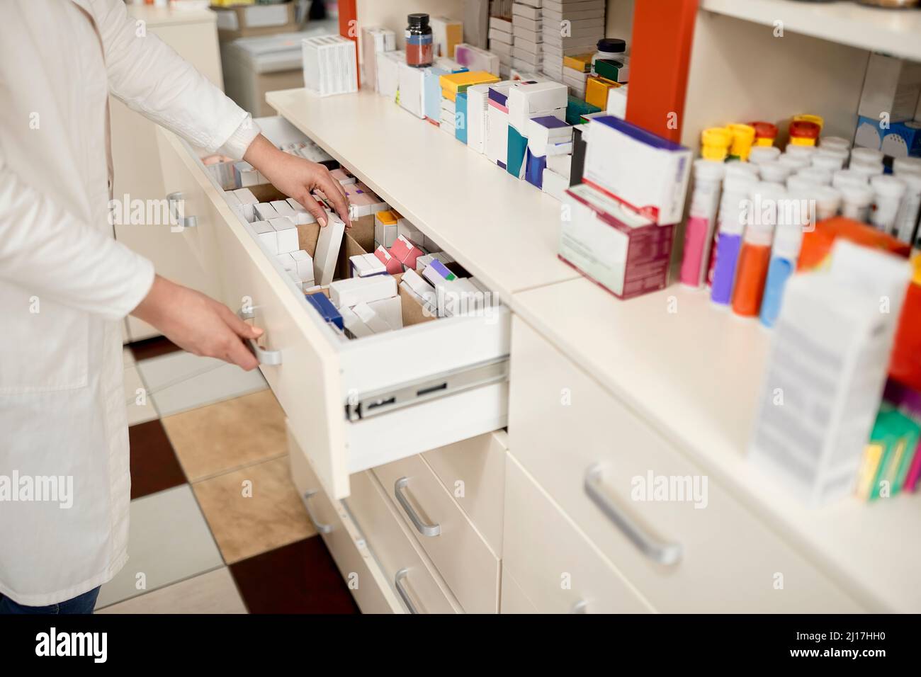 One woman arranging drawer hi-res stock photography and images - Alamy