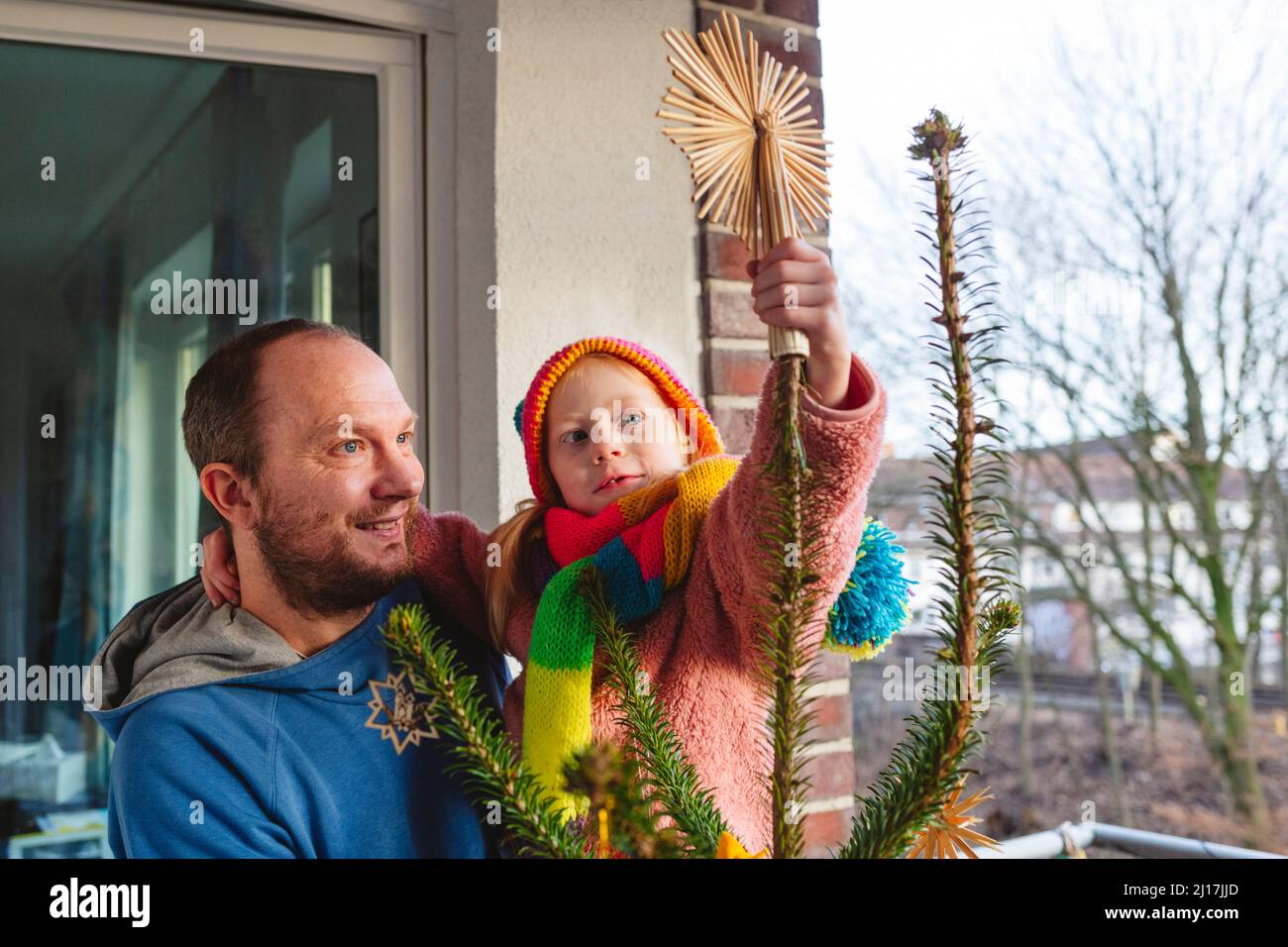 Children carrying christmas tree hi-res stock photography and images ...