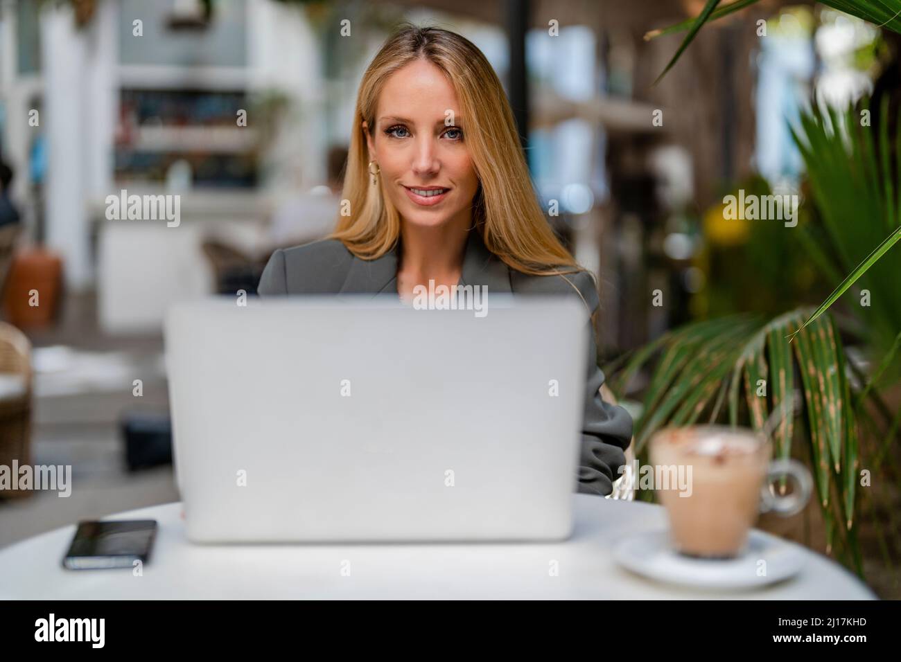 Beautiful female freelancer working outdoors hi-res stock photography ...