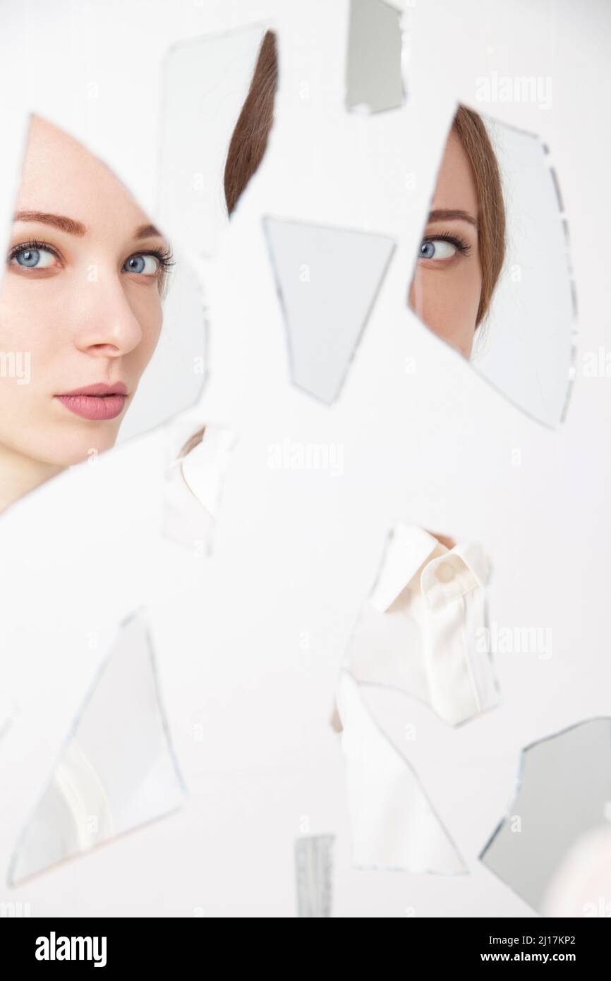 Person looking at a broken mirror hi-res stock photography and images ...