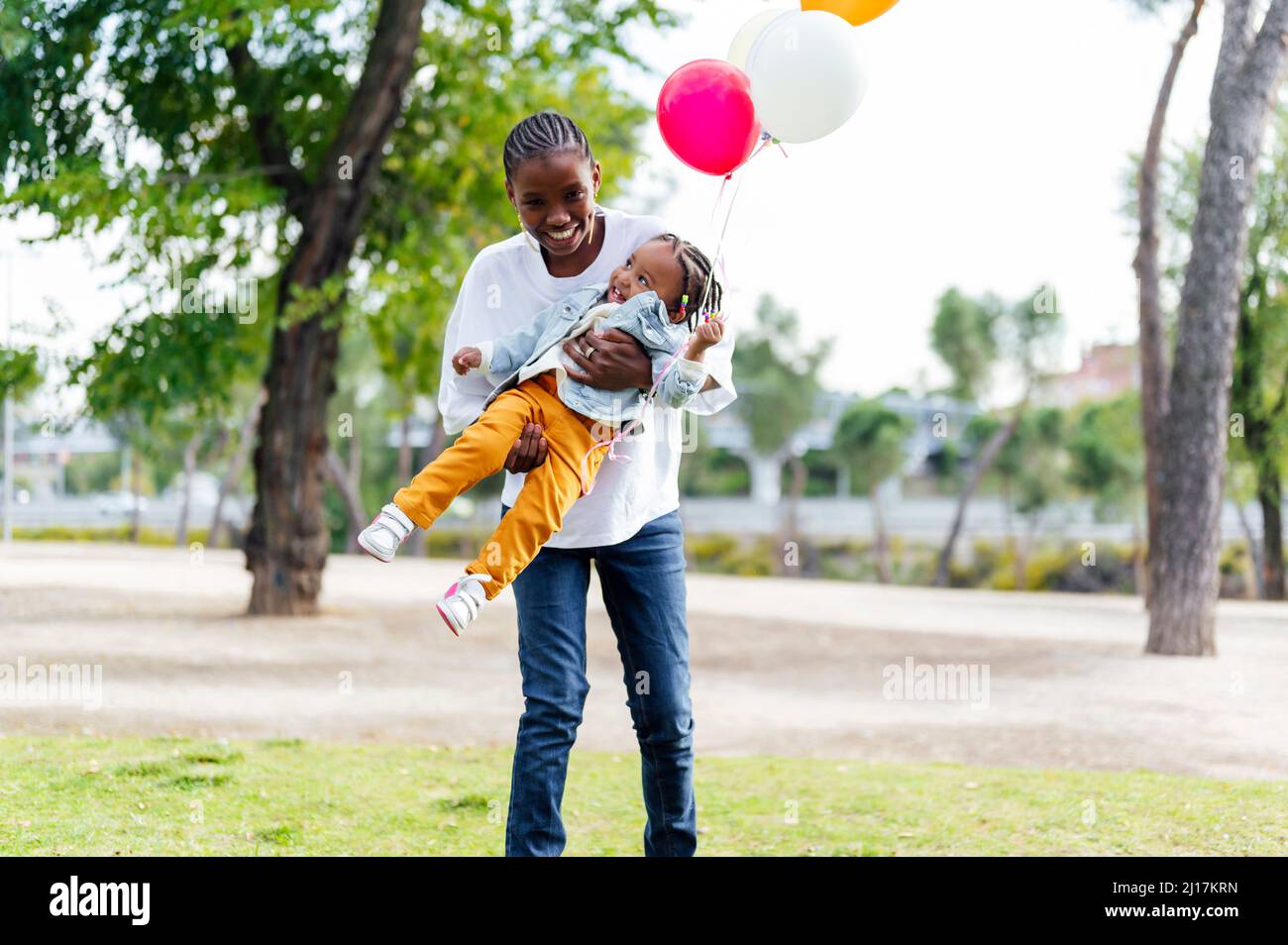 Carrying balloon balloons hi-res stock photography and images - Alamy