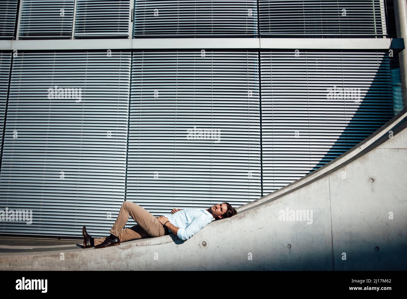 Lying on side of building hi-res stock photography and images - Alamy