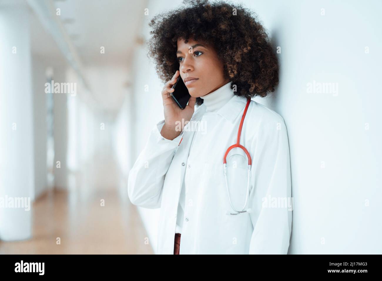 African female doctor using smartphone hi-res stock photography and ...