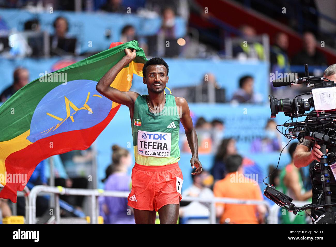 Samuel Tefera celebrating her victory with the flag at the Belgrade ...