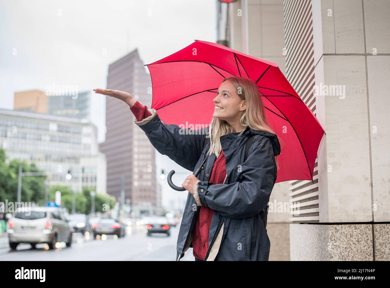 Woman red umbrella hi-res stock photography and images - Alamy