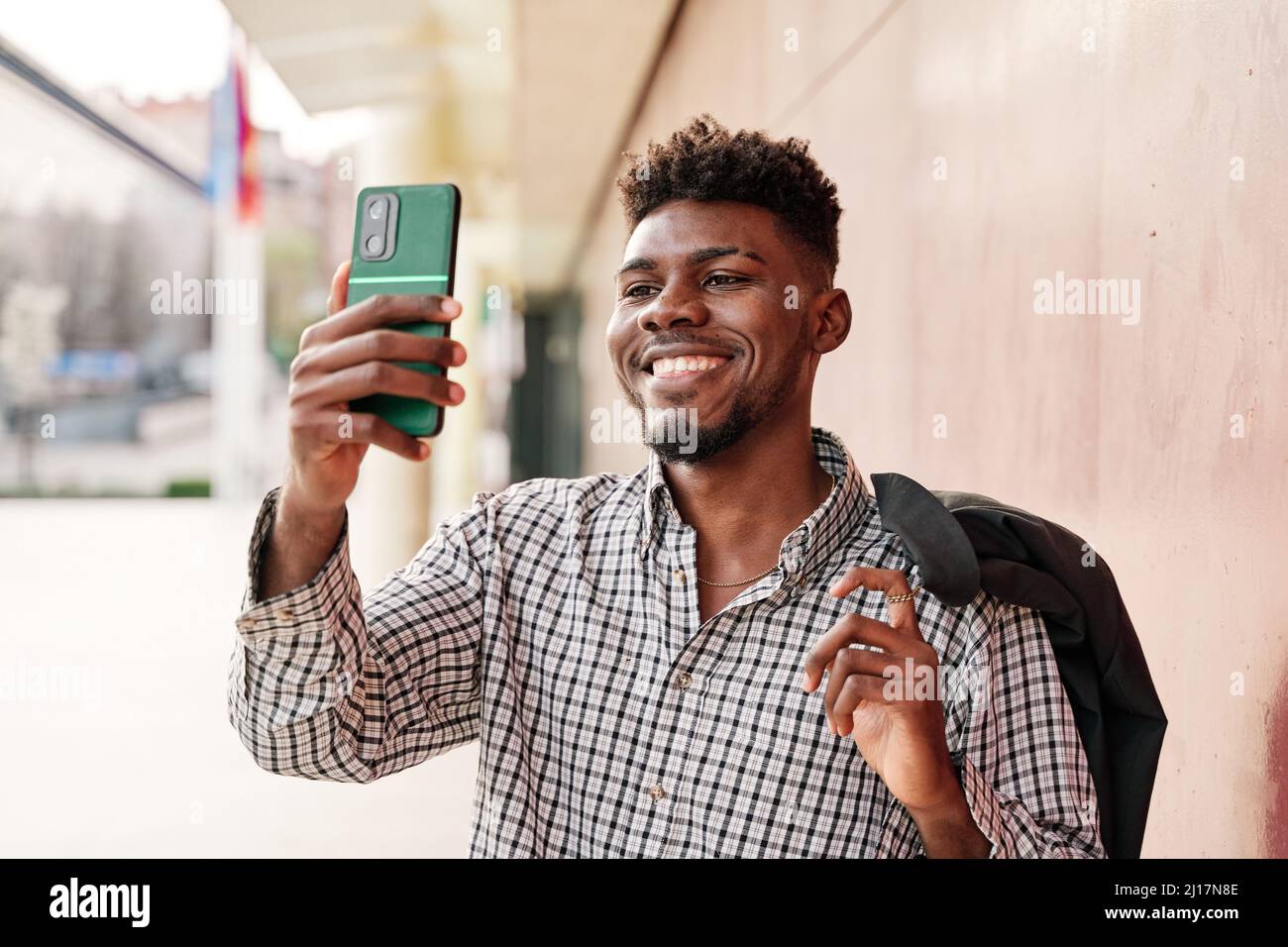 Jacket over arm hi-res stock photography and images - Alamy