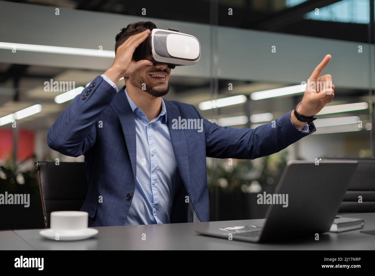 Man sitting using vr hi-res stock photography and images - Alamy