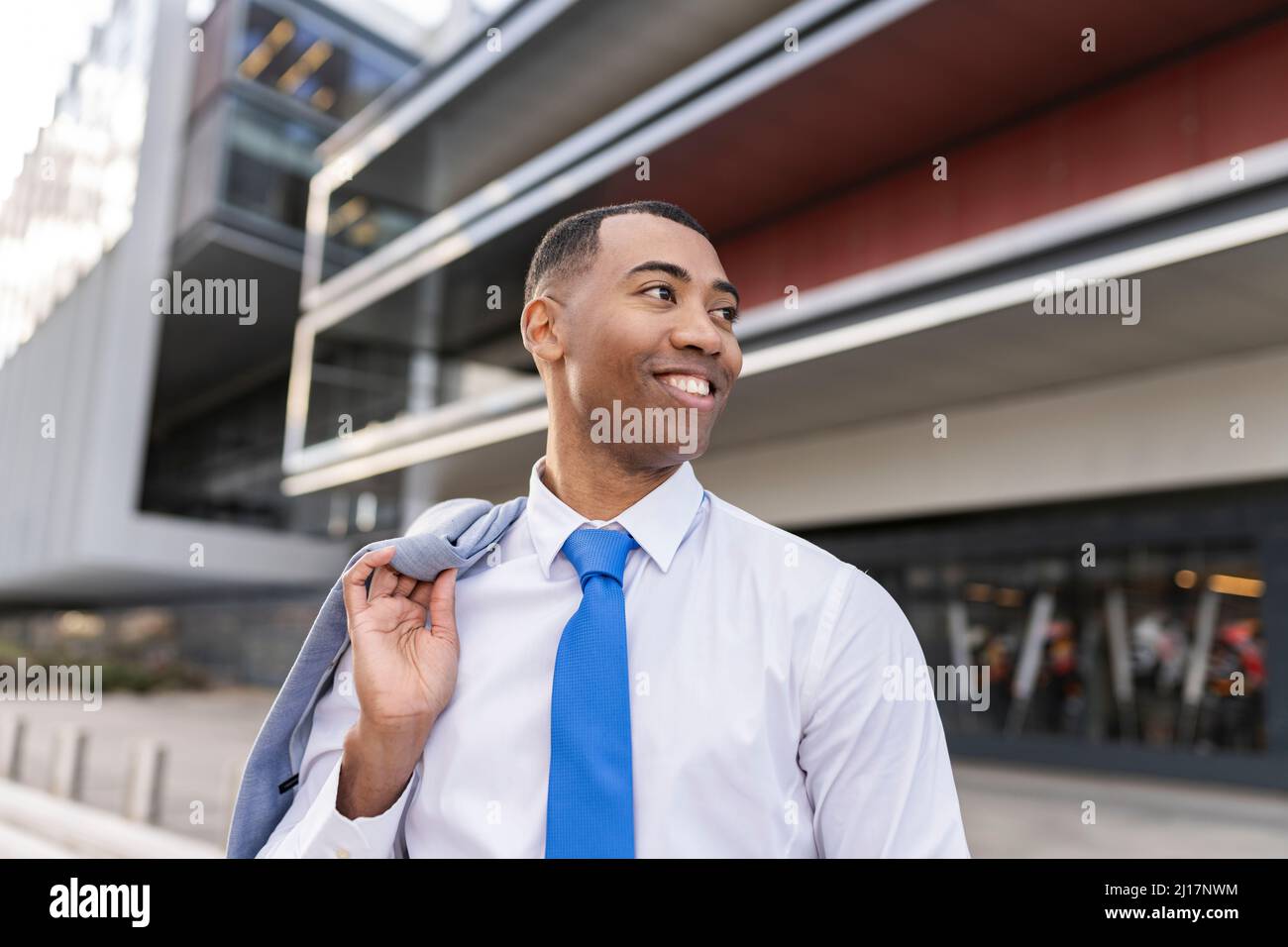 Smiling african american businessman standing hi-res stock photography ...