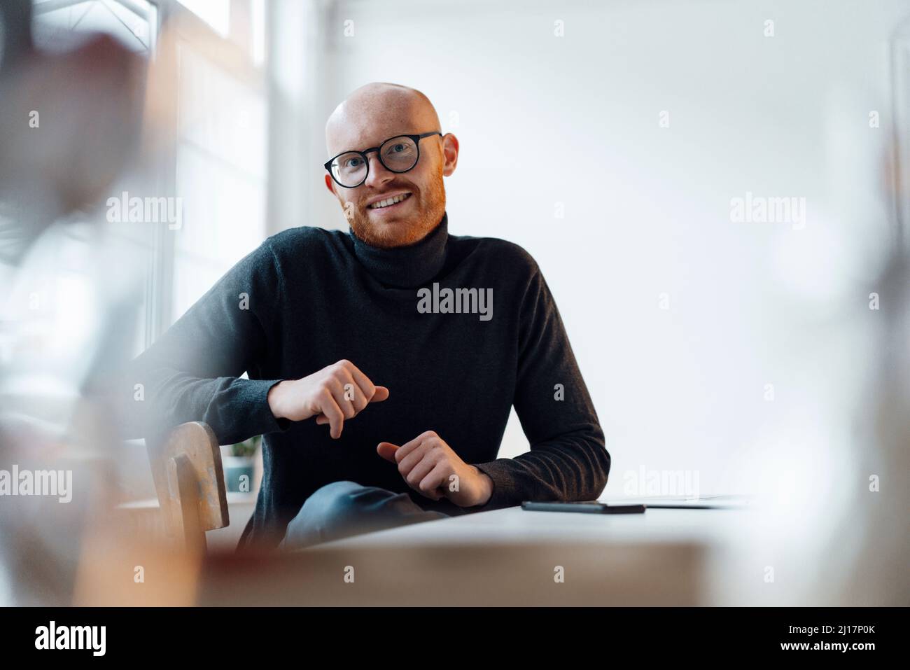 Bald man sitting desk hi-res stock photography and images - Alamy
