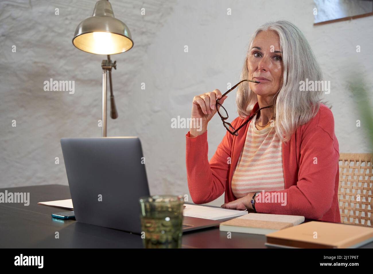 Confident freelancer with eyeglasses working at home Stock Photo - Alamy