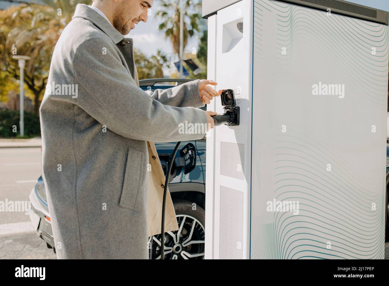 Man plugging in power hi-res stock photography and images - Alamy
