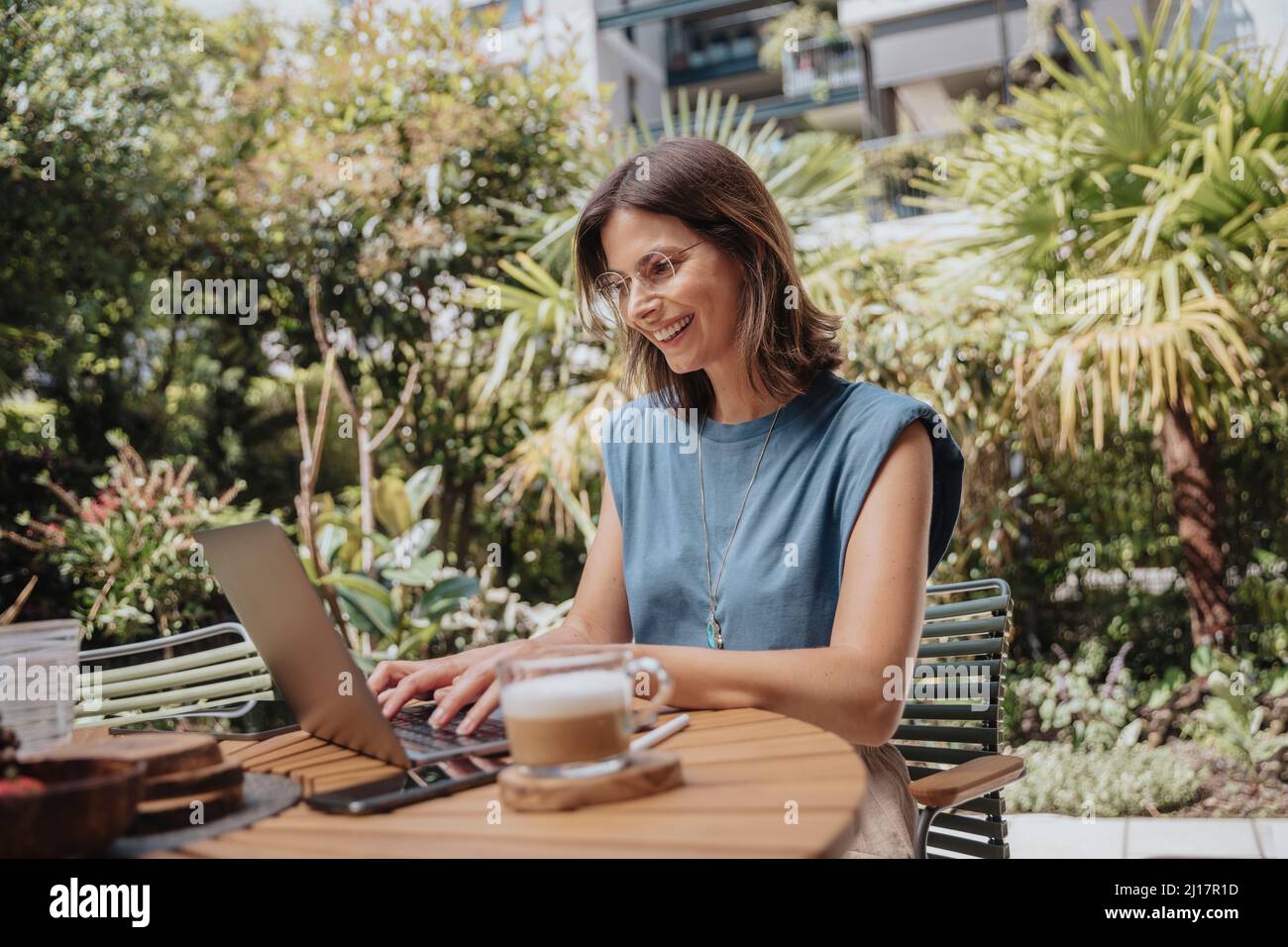 Woman working in yard hi-res stock photography and images - Alamy
