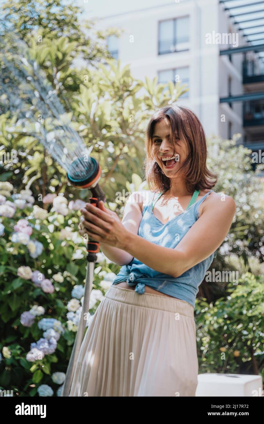 Woman hose pipe hi-res stock photography and images - Alamy