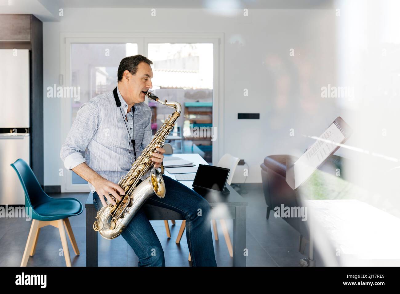 Three men blowing hi-res stock photography and images - Alamy