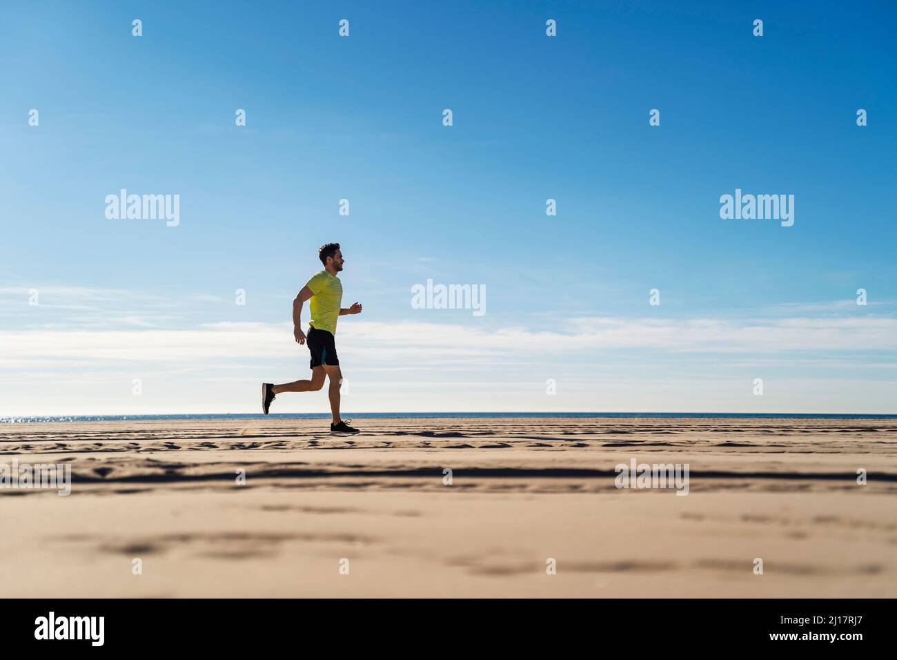 Male athlete beach running hi-res stock photography and images - Alamy