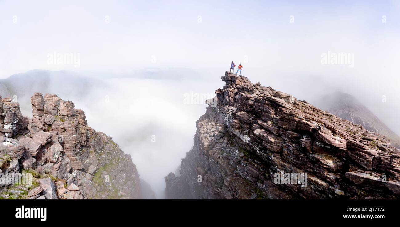 Caucasian man on edge cliff hi-res stock photography and images - Alamy