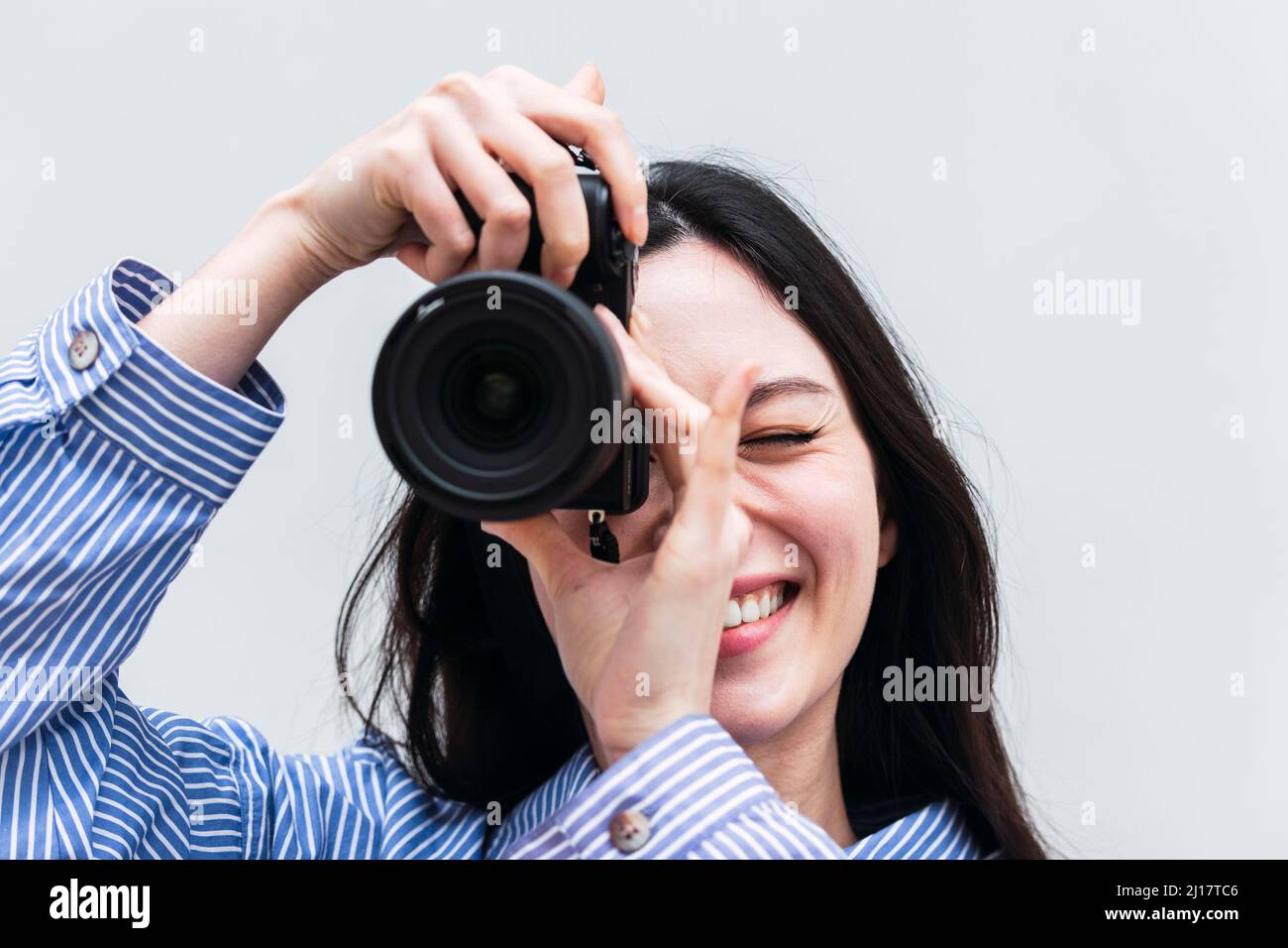 Smiling holding standing camera photographic themes hi-res stock ...
