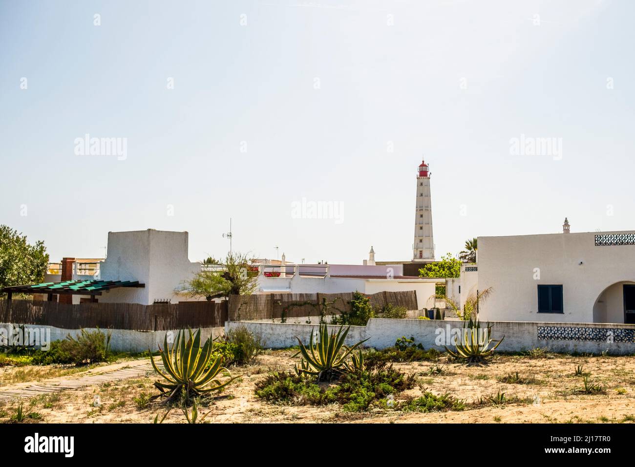 Architecture and lighthouse at Farol Island, Faro District, Algarve ...