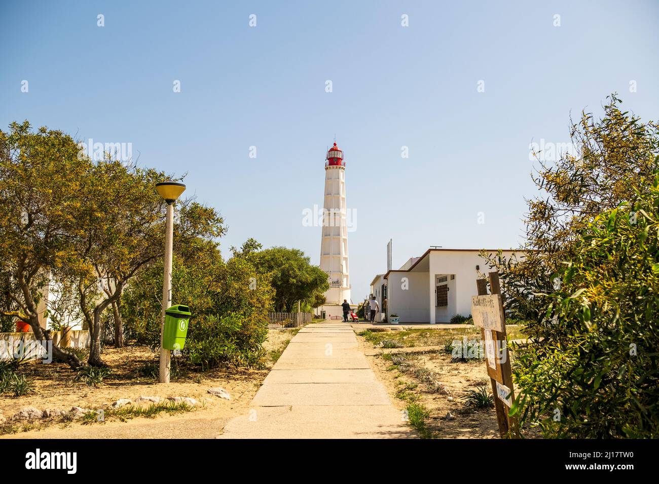 Architecture and lighthouse at Farol Island, Faro District, Algarve ...