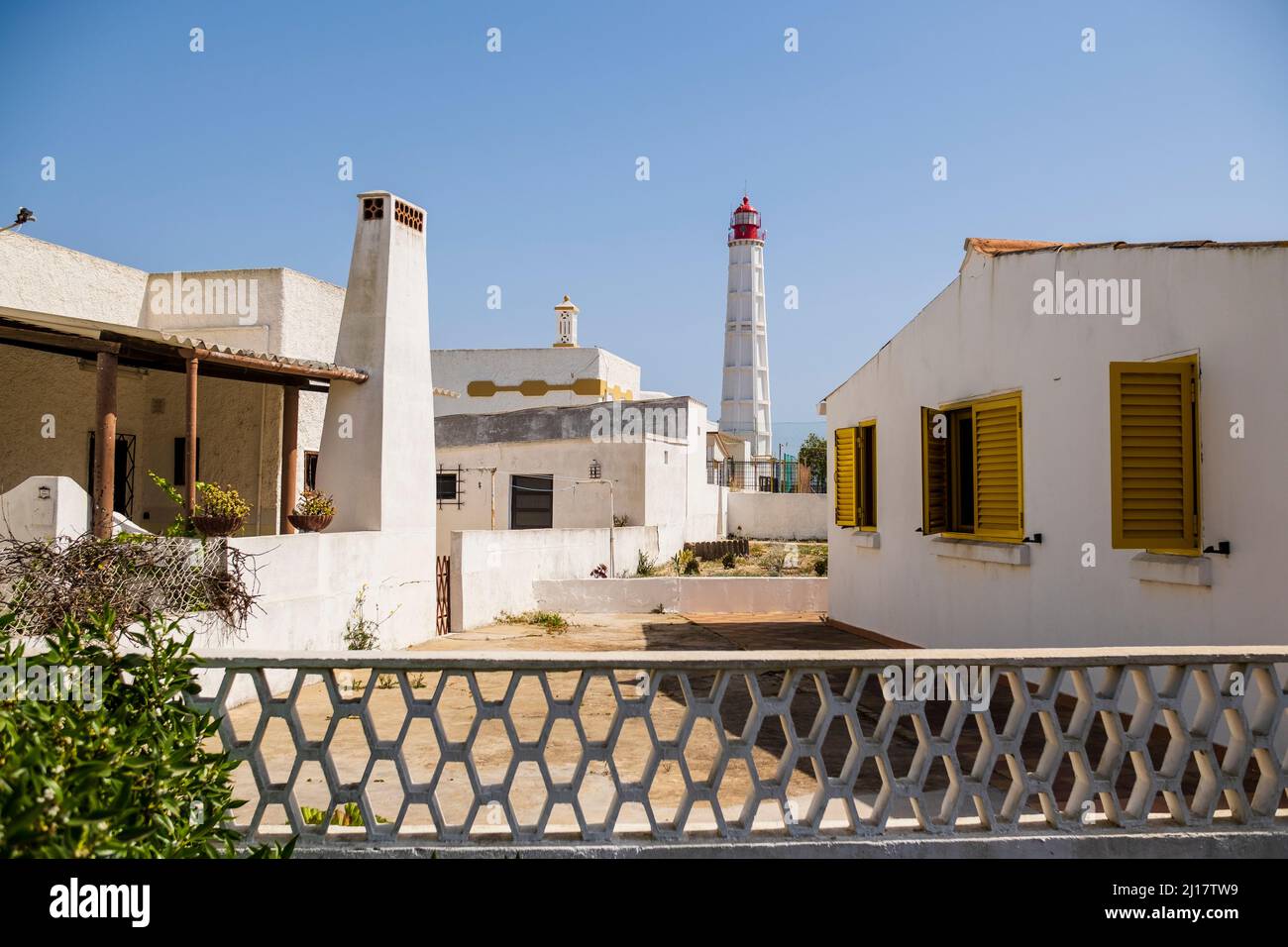 Architecture and lighthouse at Farol Island, Faro District, Algarve ...