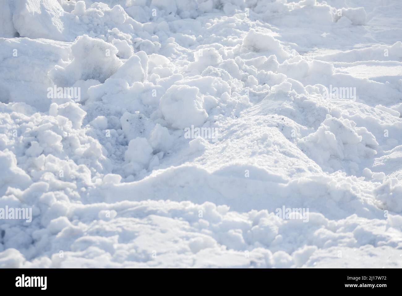Uneven snowdrift of loose snow. Winter background. It's frosty day ...