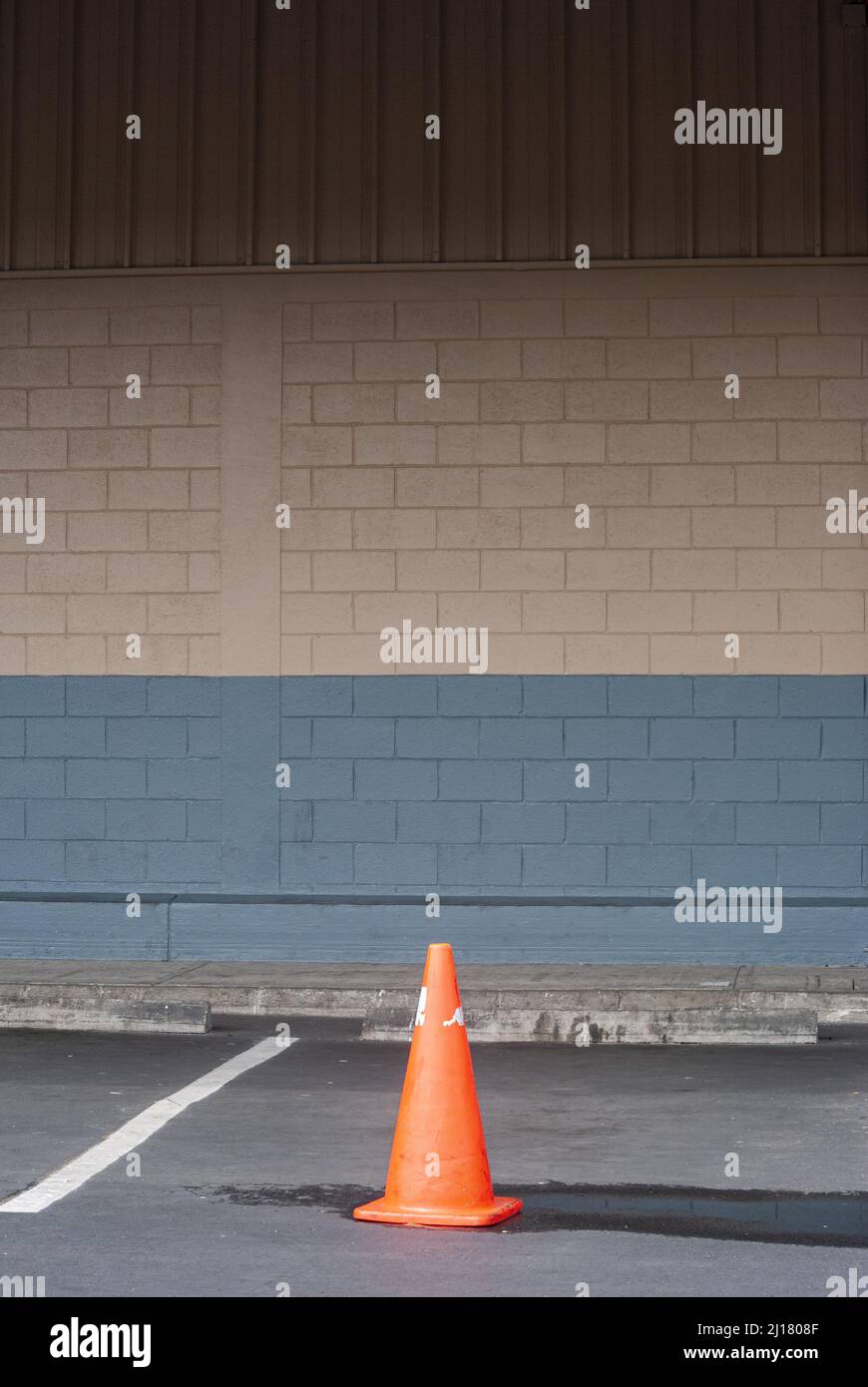 Cone signage in parking area in shopping center, reserved and empty ...