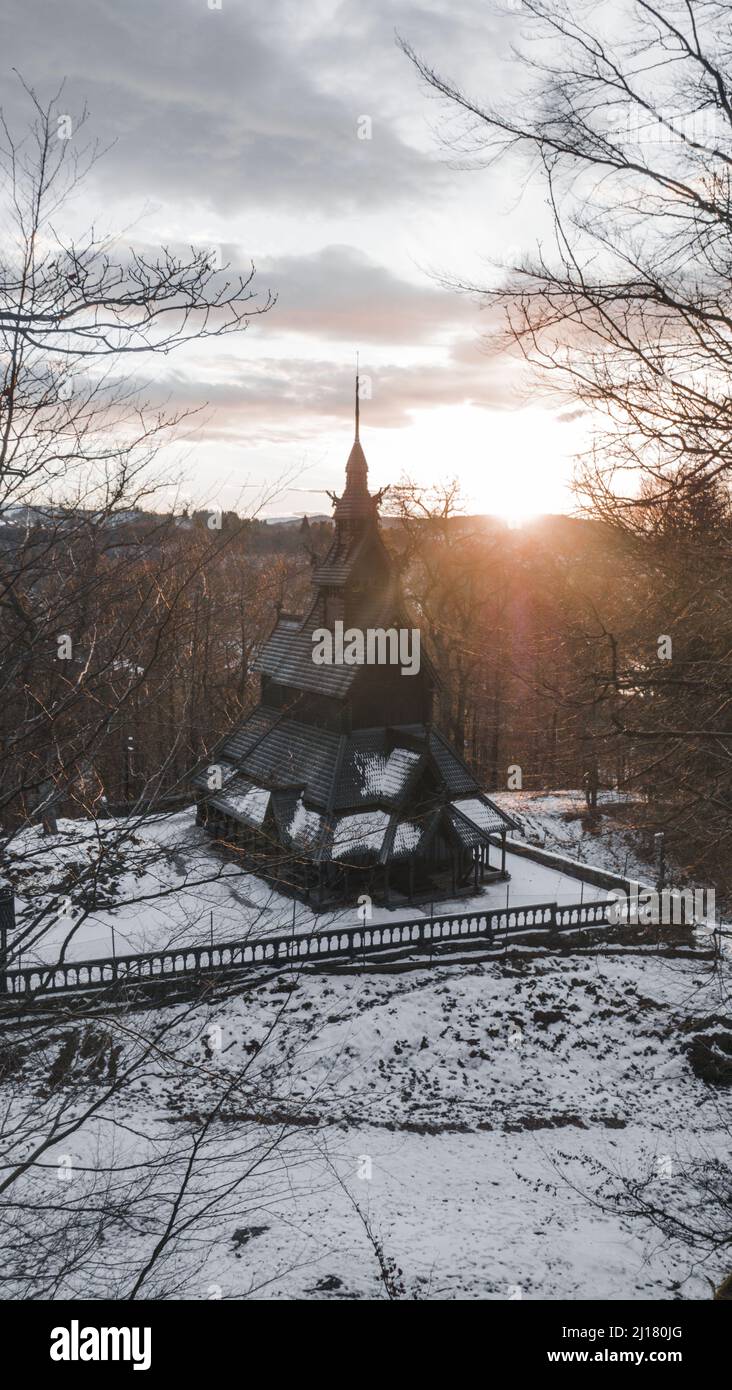 The facade of the Fantoft Stave Church in Bergen under a cloudy sky ...