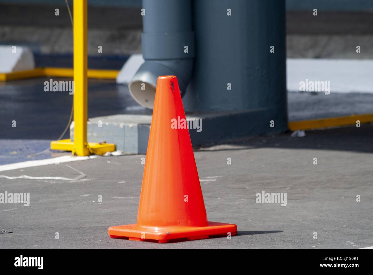 Cone signage in parking area in shopping center, reserved and empty ...