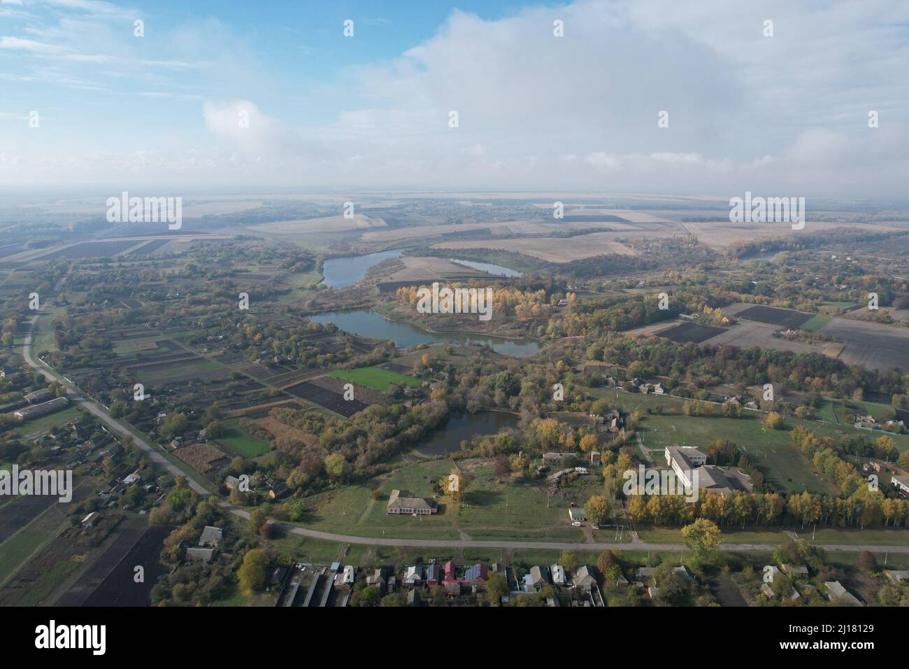The aerial shot of the Ukrainian village near Kharkiv city from a drone ...