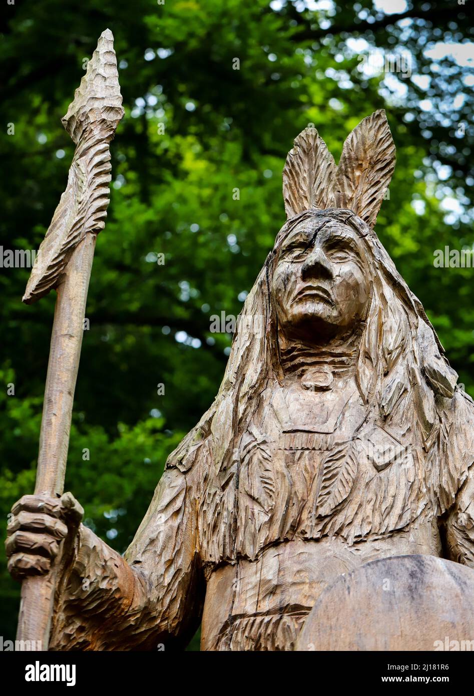 Red Indian wooden sculpture at Dawyck Stock Photo - Alamy
