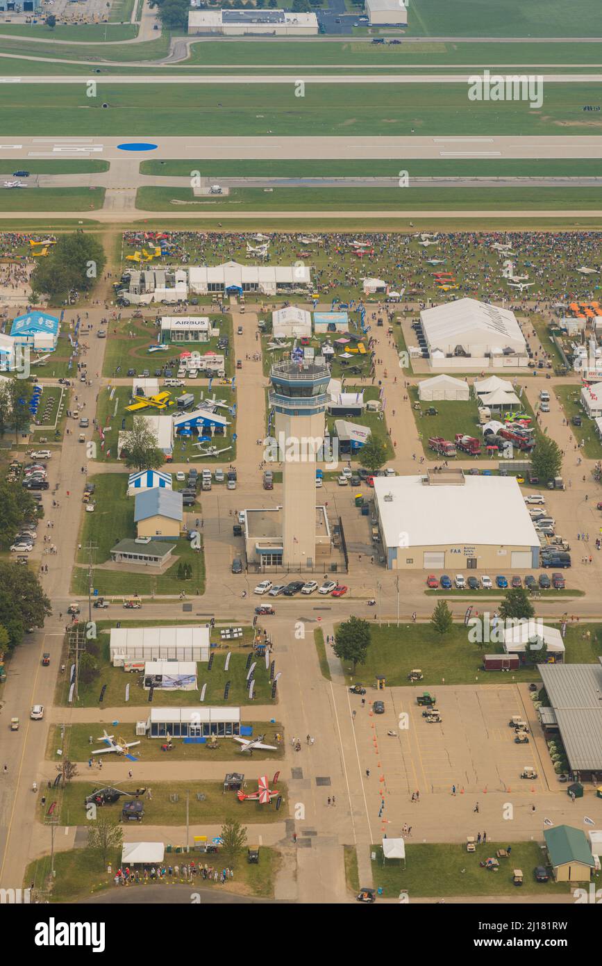 An aerial view of EAA Airventure grounds with planes and tents and the ...