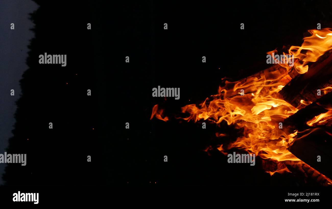 A close-up shot of a big bonfire at night Stock Photo - Alamy