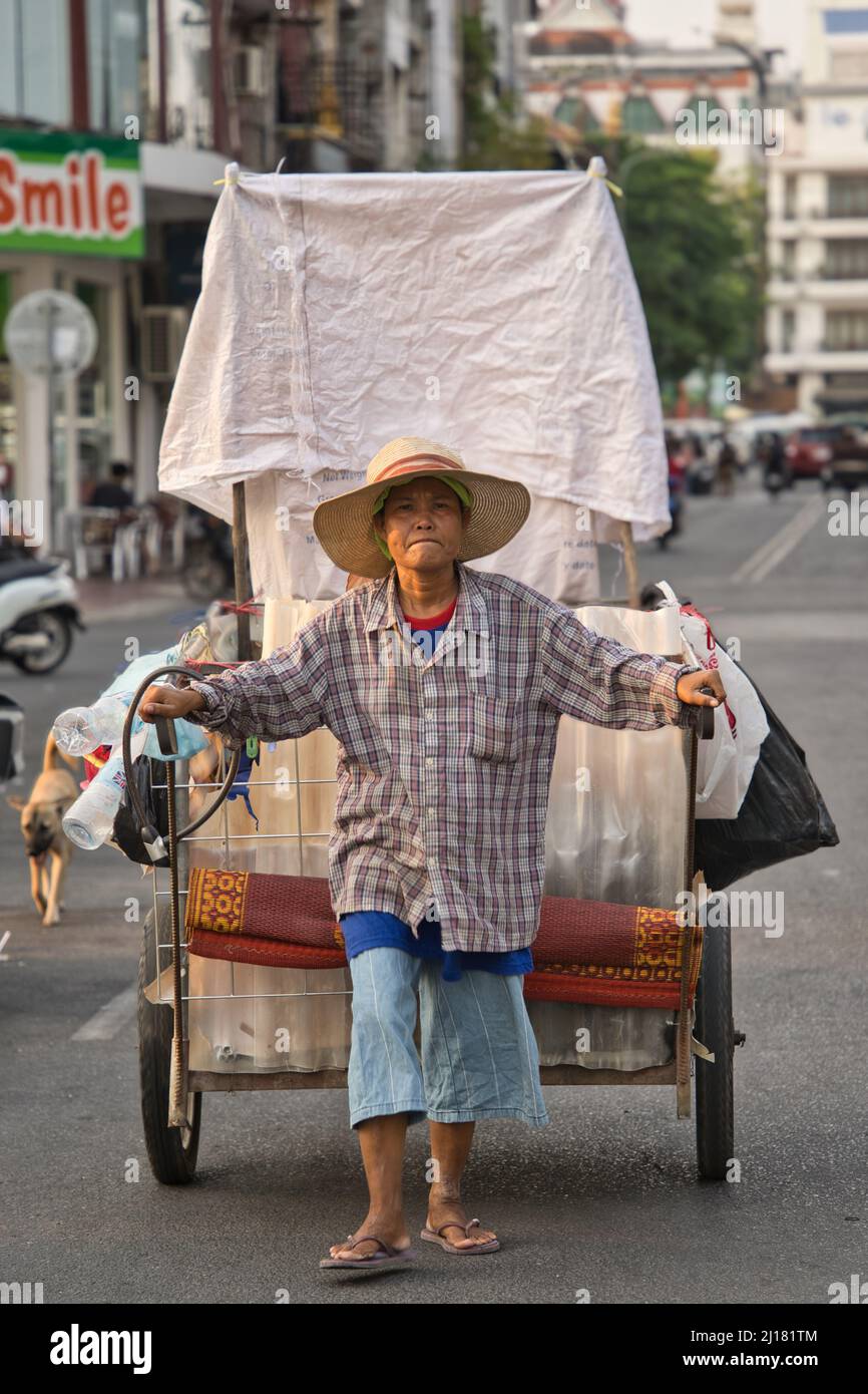 A closeup of a Street vendor in Phnom Penh pulling his trolley Stock ...