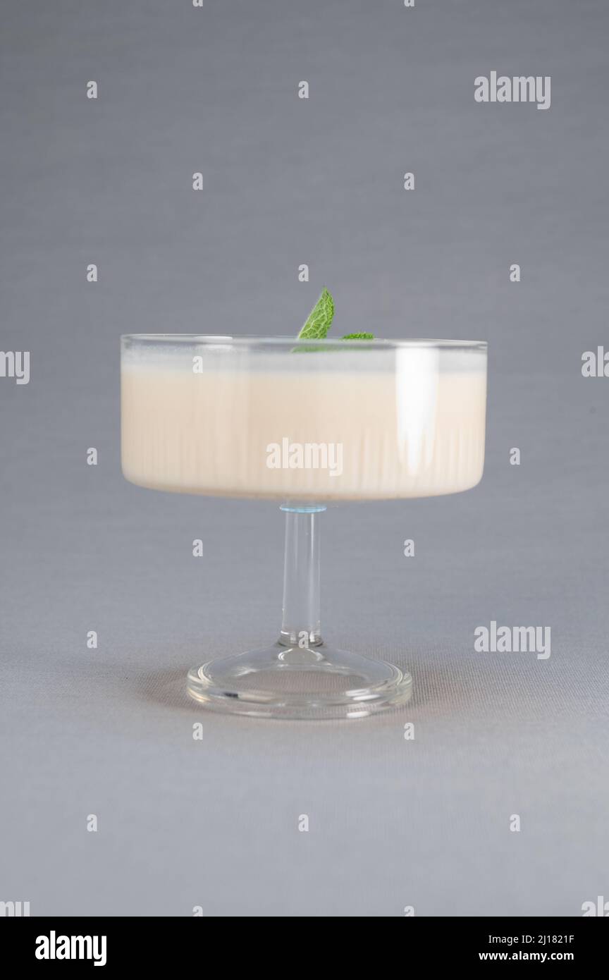 A glass of White Rabbit Cocktail with vanilla cream, gin and lemon curd ...