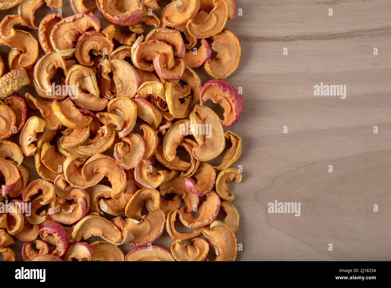 Dried natural sliced apple background, top view Stock Photo - Alamy