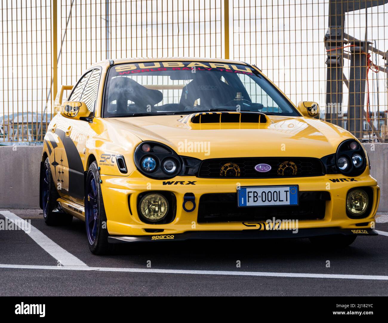 A yellow subaru gialla pakred Stock Photo - Alamy