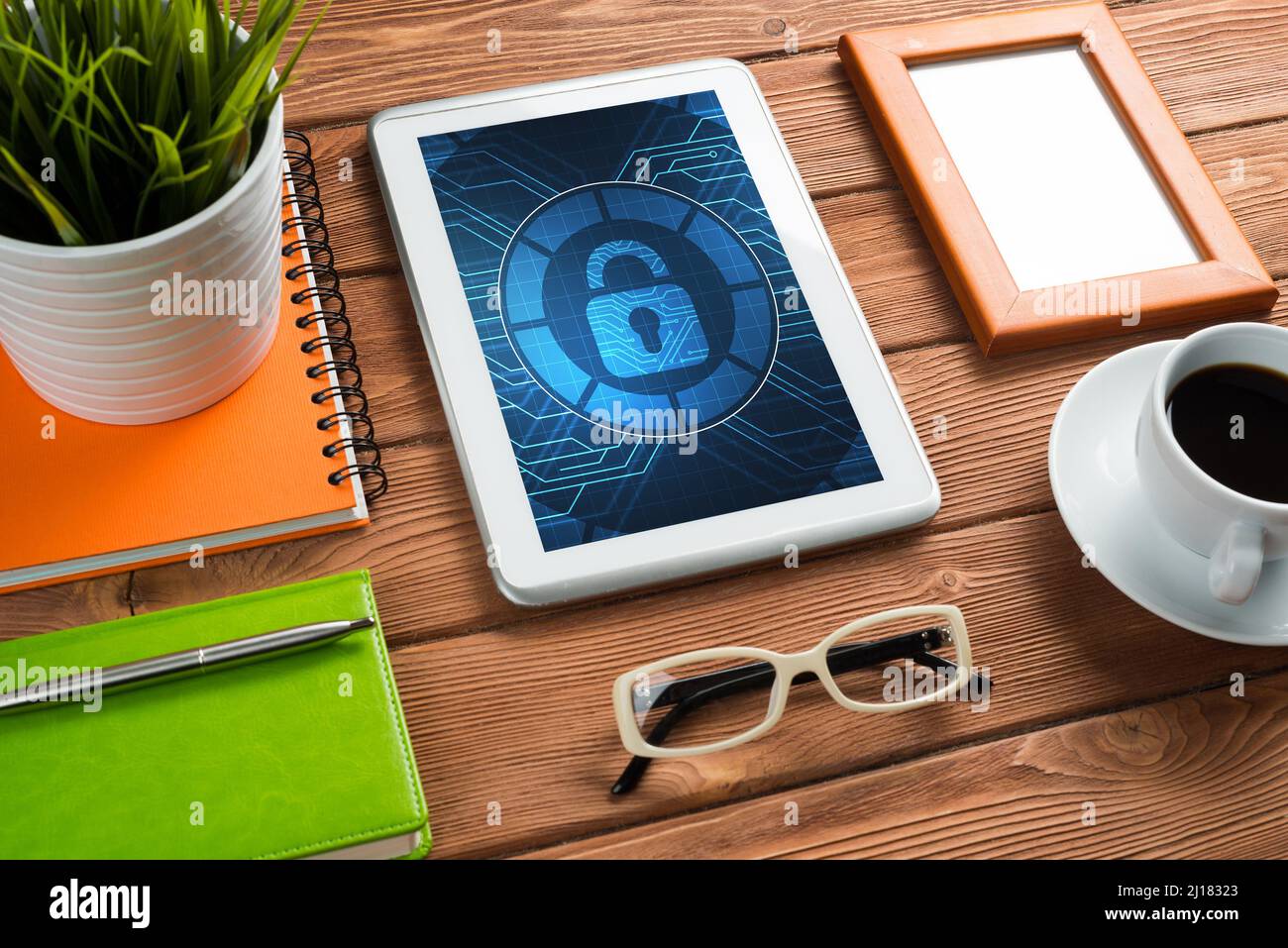 Web security and technology concept with tablet pc on wooden table ...
