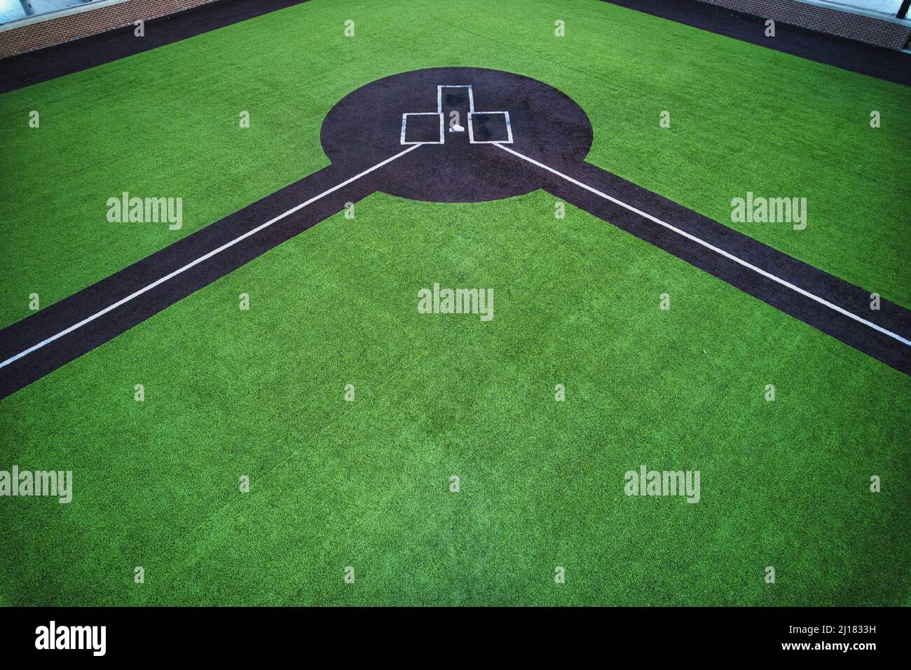 A green and smooth playing field with borders drawn in black and white ...