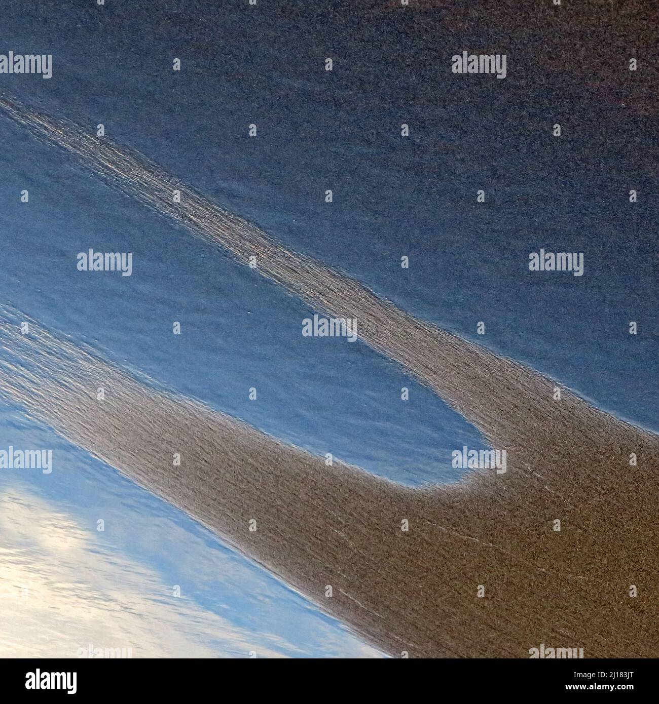 Abstract detailed tidal patterns in the sand at low tide on Penbryn ...