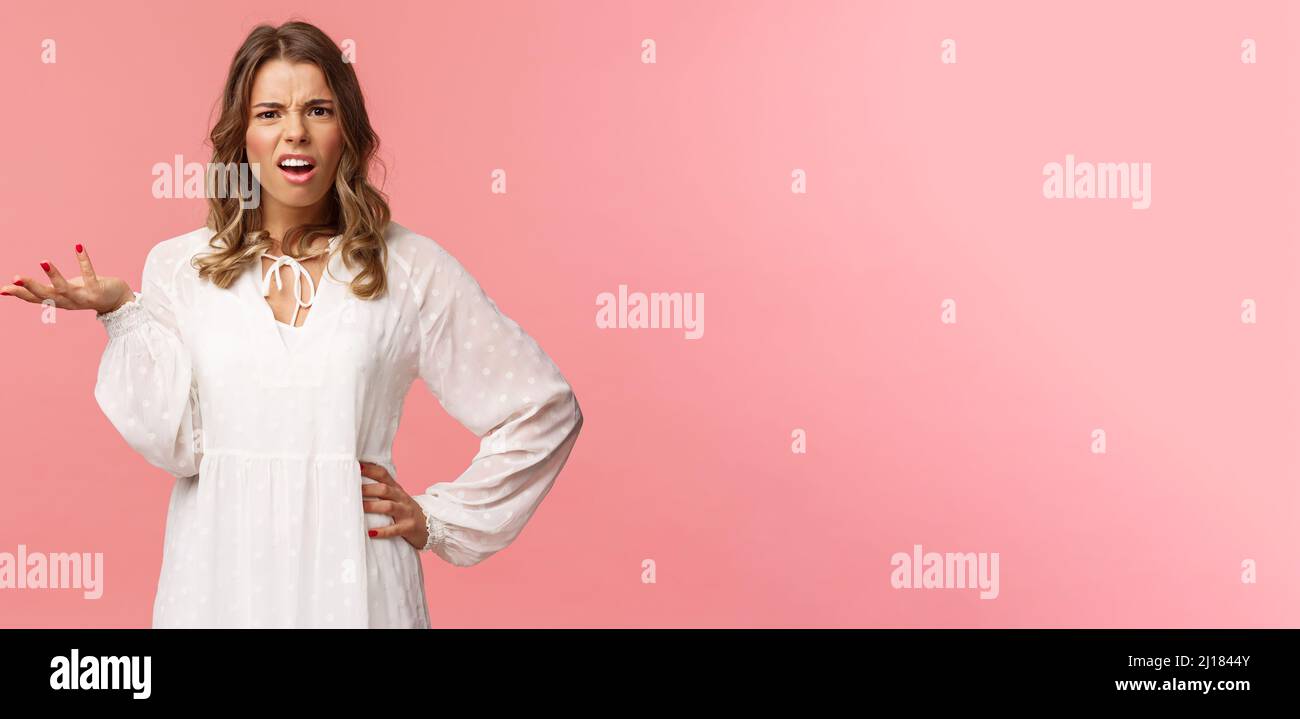 Whats your problem. Pissed-off and annoyed young blond girl looking ...