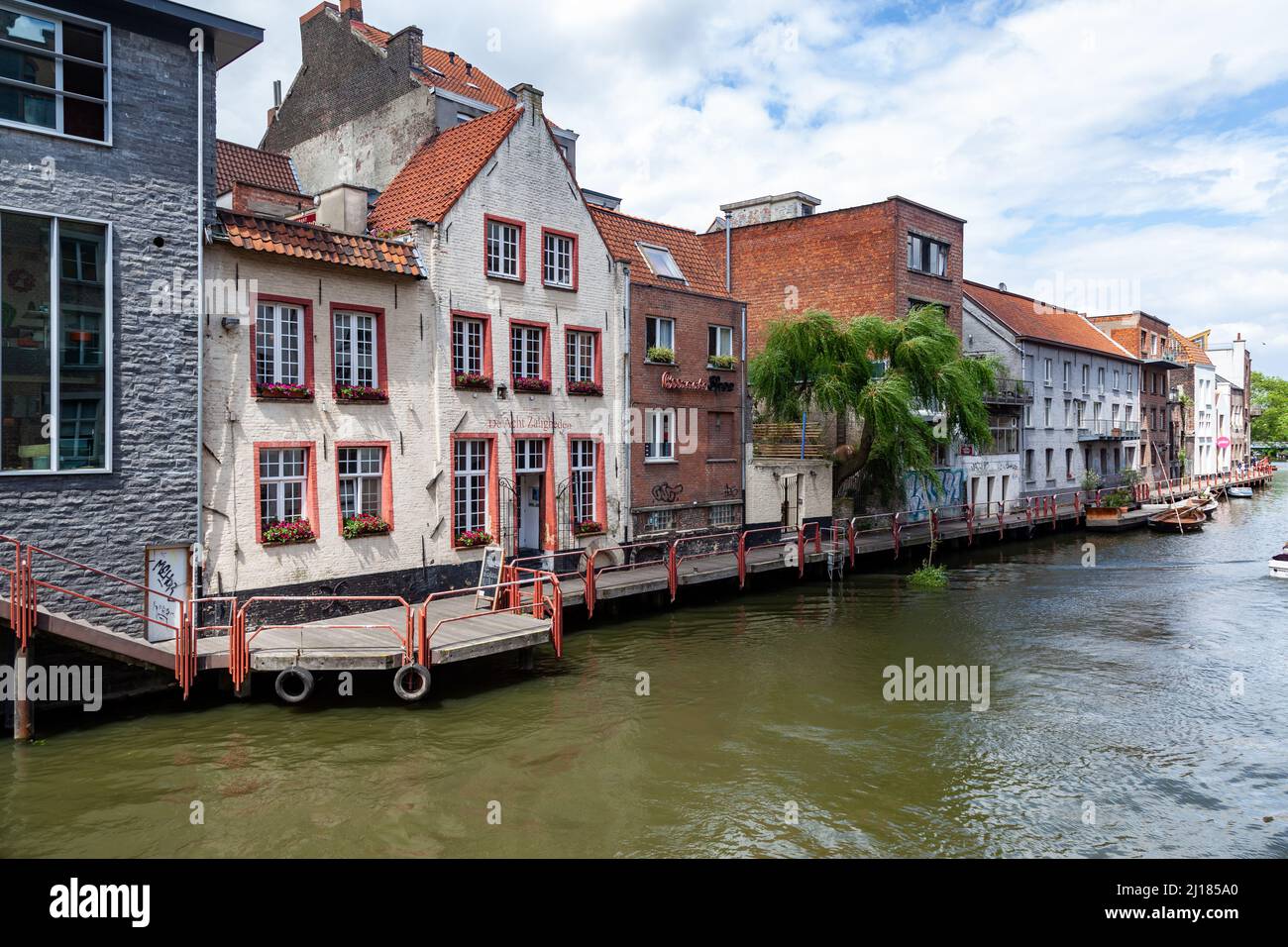 The historical Flemish houses on the water canals of Ghent, Belgium ...