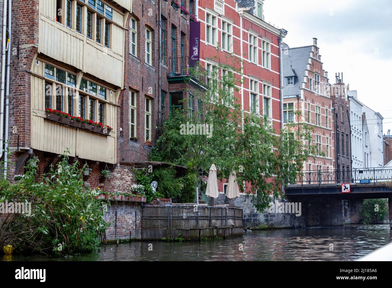 The historical Flemish houses on the water canals of Ghent, Belgium ...