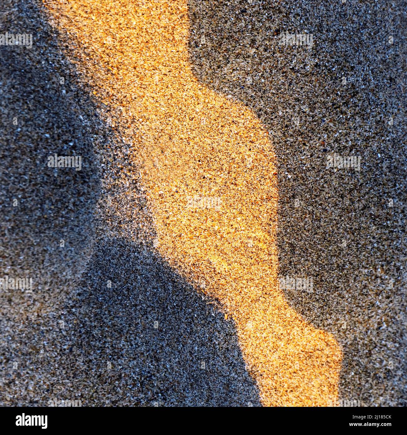 Abstract detailed tidal patterns in the sand at low tide on Penbryn ...