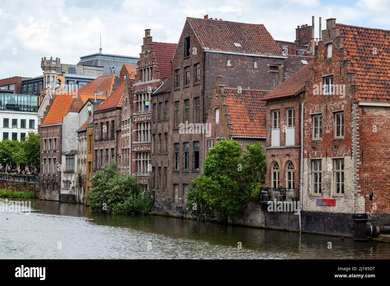 The historical flemish houses on the water canals of Ghent, Belgium ...