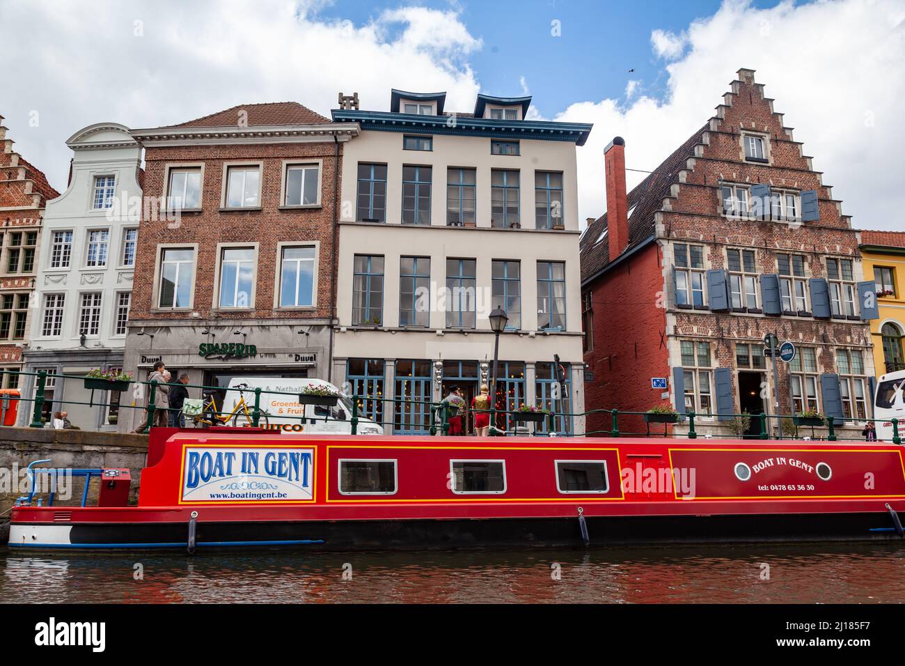The historical Flemish houses on the water canals of Ghent, Belgium ...