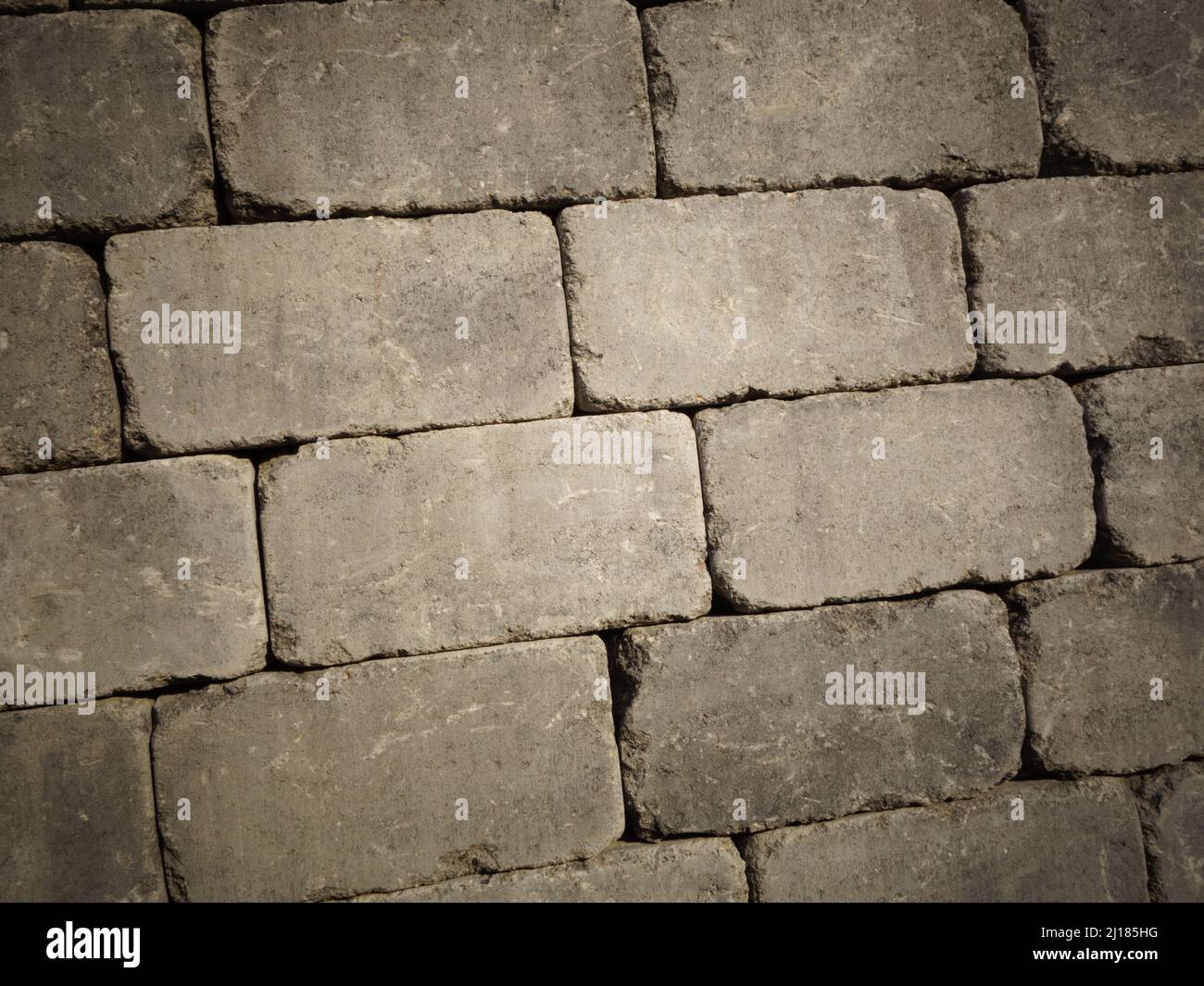 Gray stone brick wall suitable as background for text to create or ...