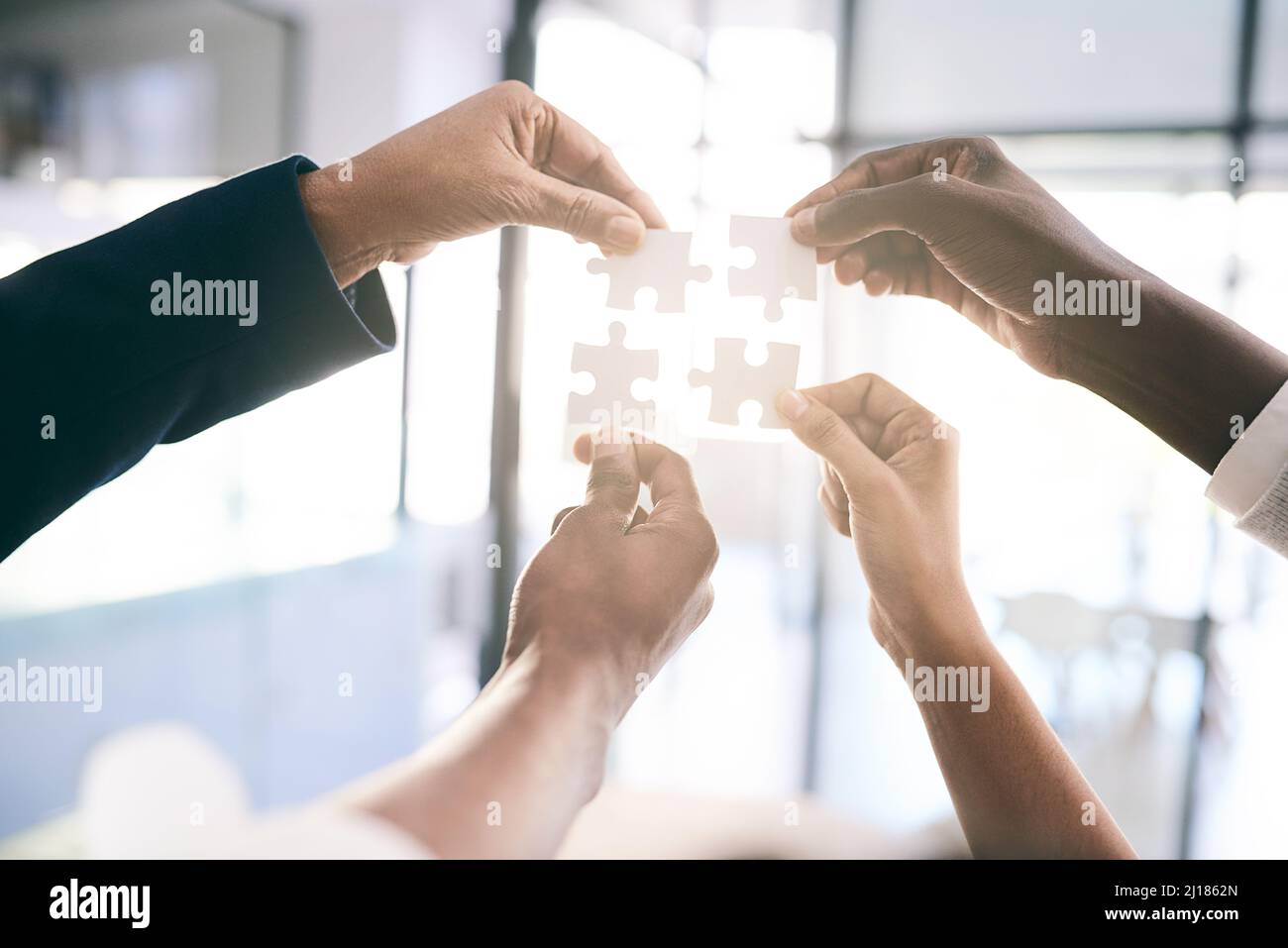We are the missing pieces. Shot of a motivated group of unrecognizable ...