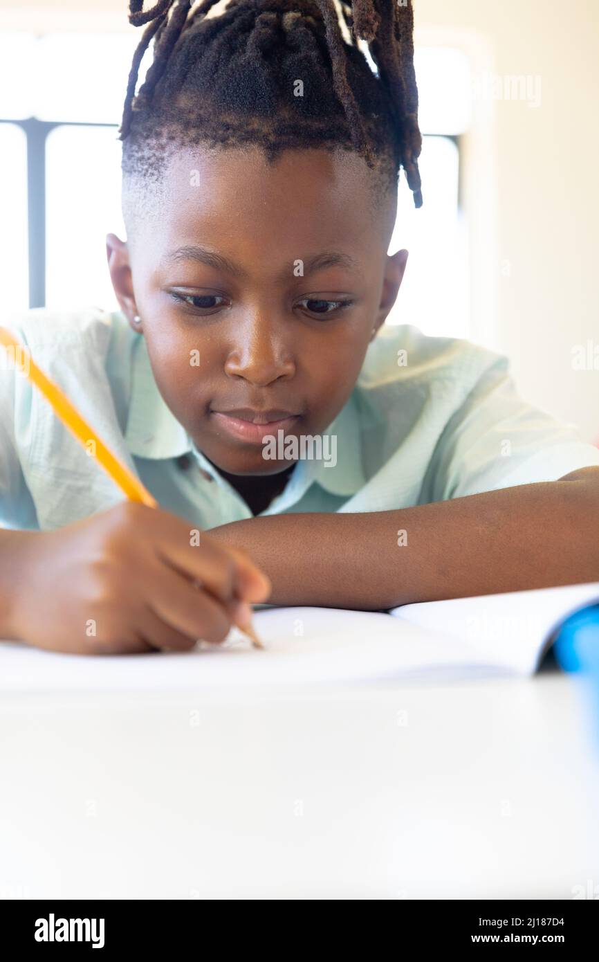 African schoolboy writing hi-res stock photography and images - Alamy