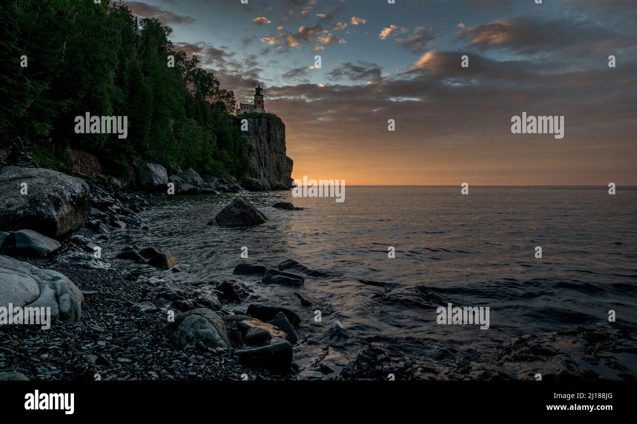 Lighthouse at sunrise in off of the great lakes Stock Photo - Alamy