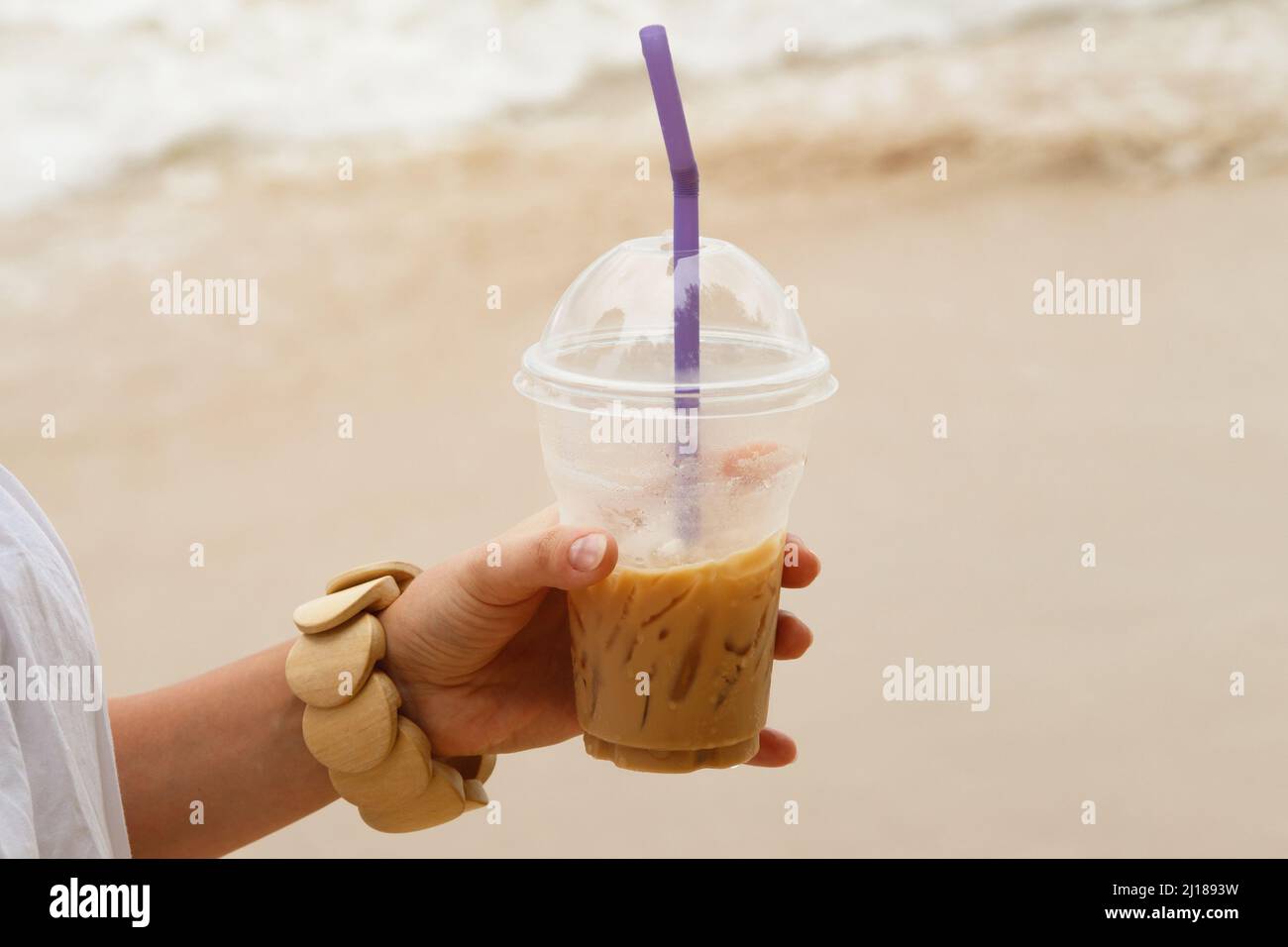 Female hand holding iced coffee hi-res stock photography and images - Alamy
